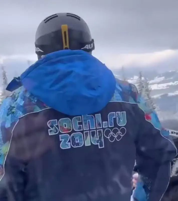 A foreigner wearing a jacket with the inscription "Sochi 2014" was ...
